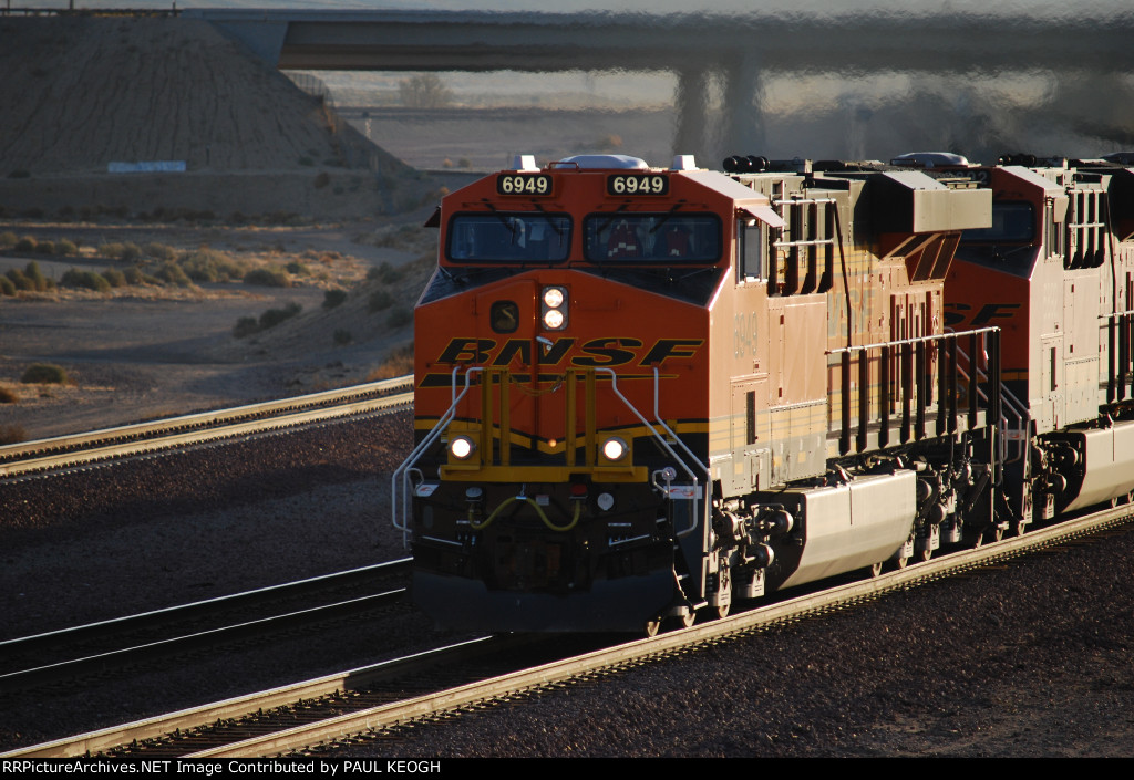 Right Front Quartering shot of the BNSF 6949 as she pulls west with a Loaded Tanker Train.